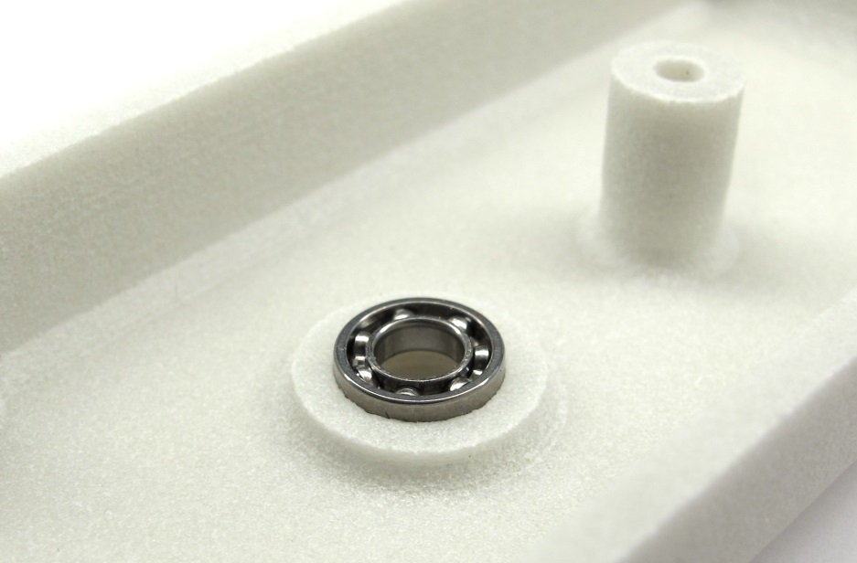 *Place the transmission bearings on the shell and push them in with ...